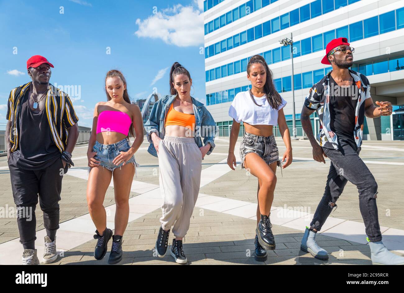 Hip hop crew dancing - Multiracial group of people having fun outdoors ...