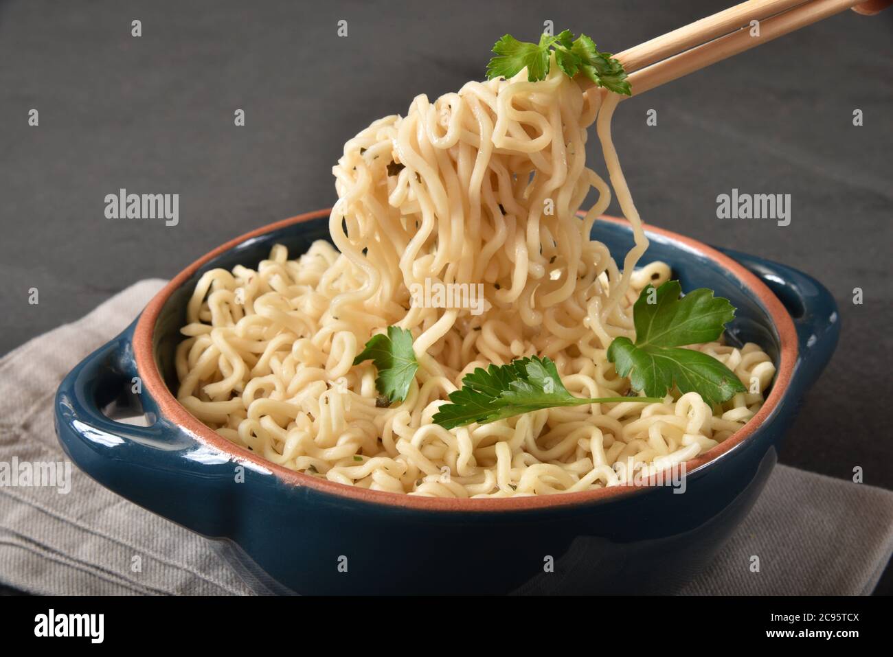 Eating raman noodles with chop sticks close up Stock Photo - Alamy