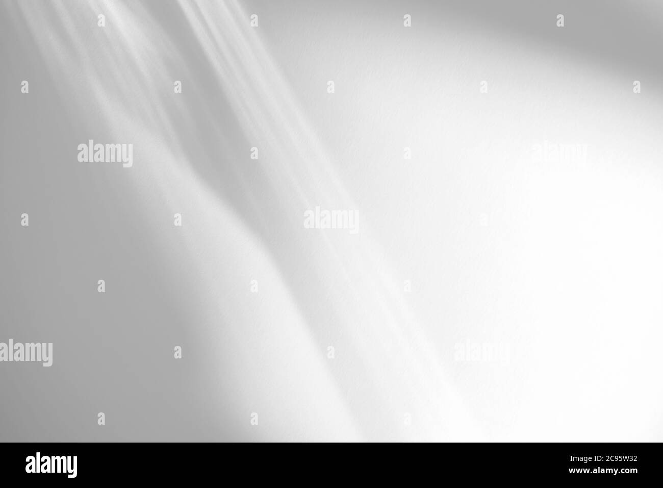 Organic drop shadow on a white wall Stock Photo - Alamy