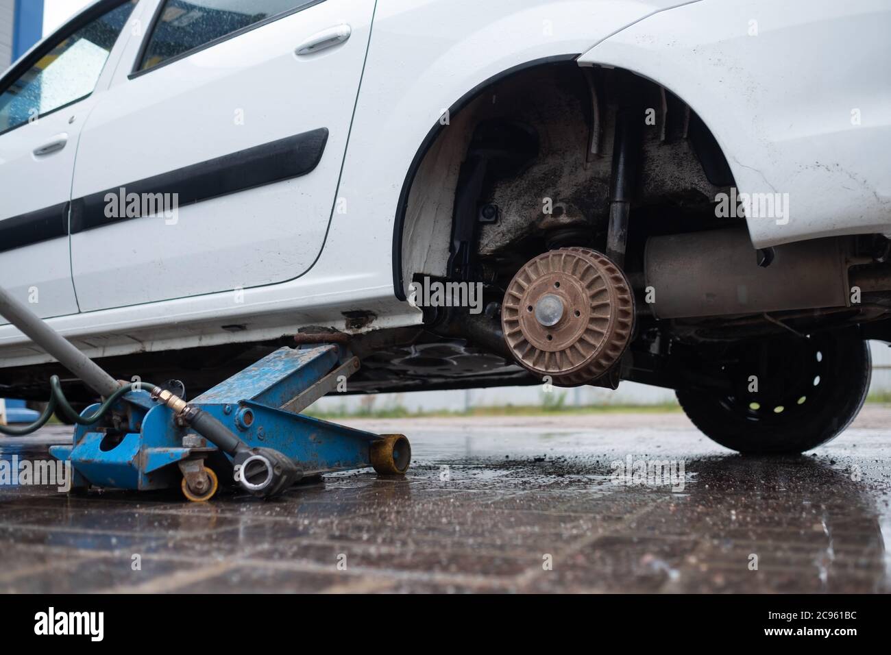 Repair of a wheel punched on the road Stock Photo - Alamy