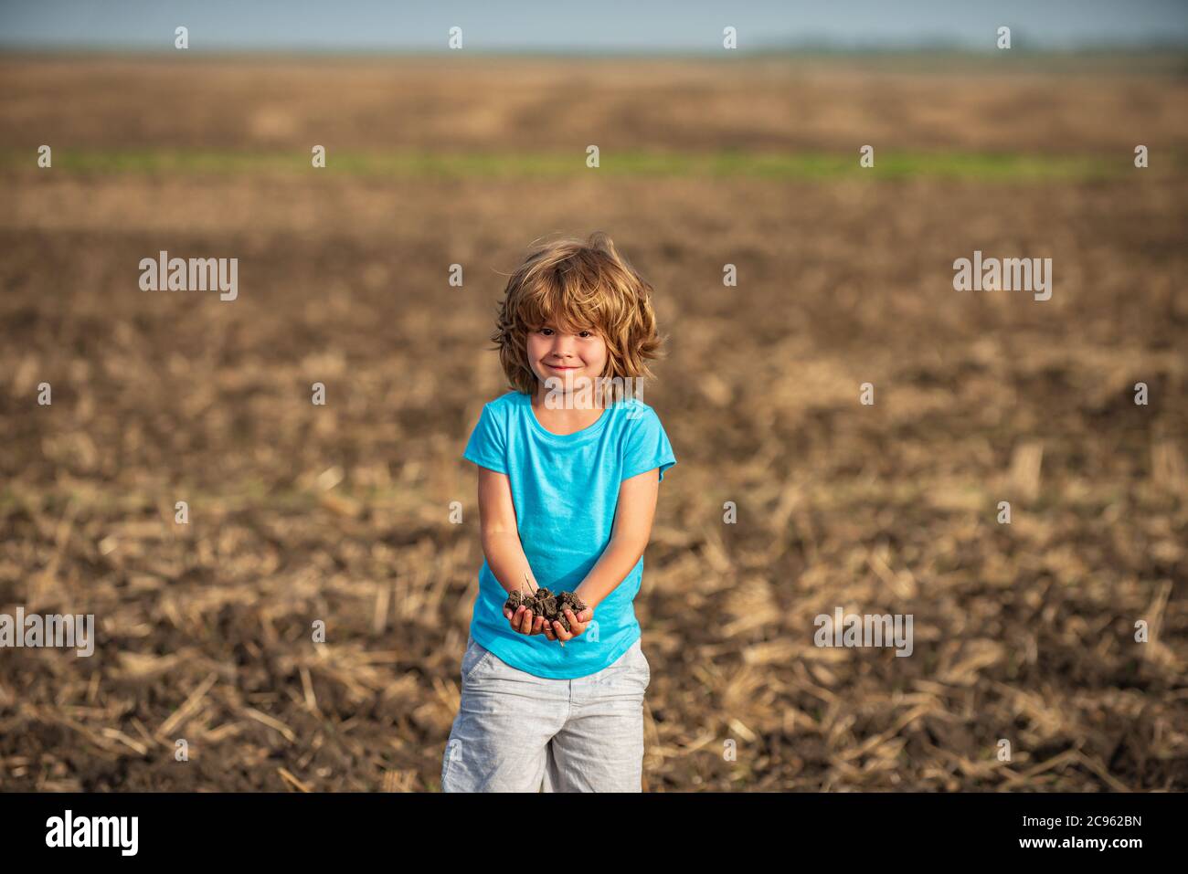 Kids farmer. American child on farm. Soil and ground concept. Textured ...