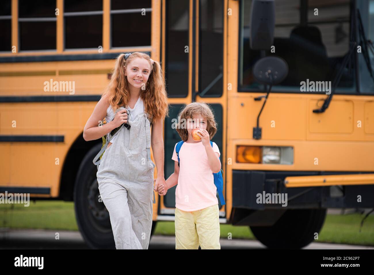 Elementary school students on school bus. Little ready to study. Happy ...