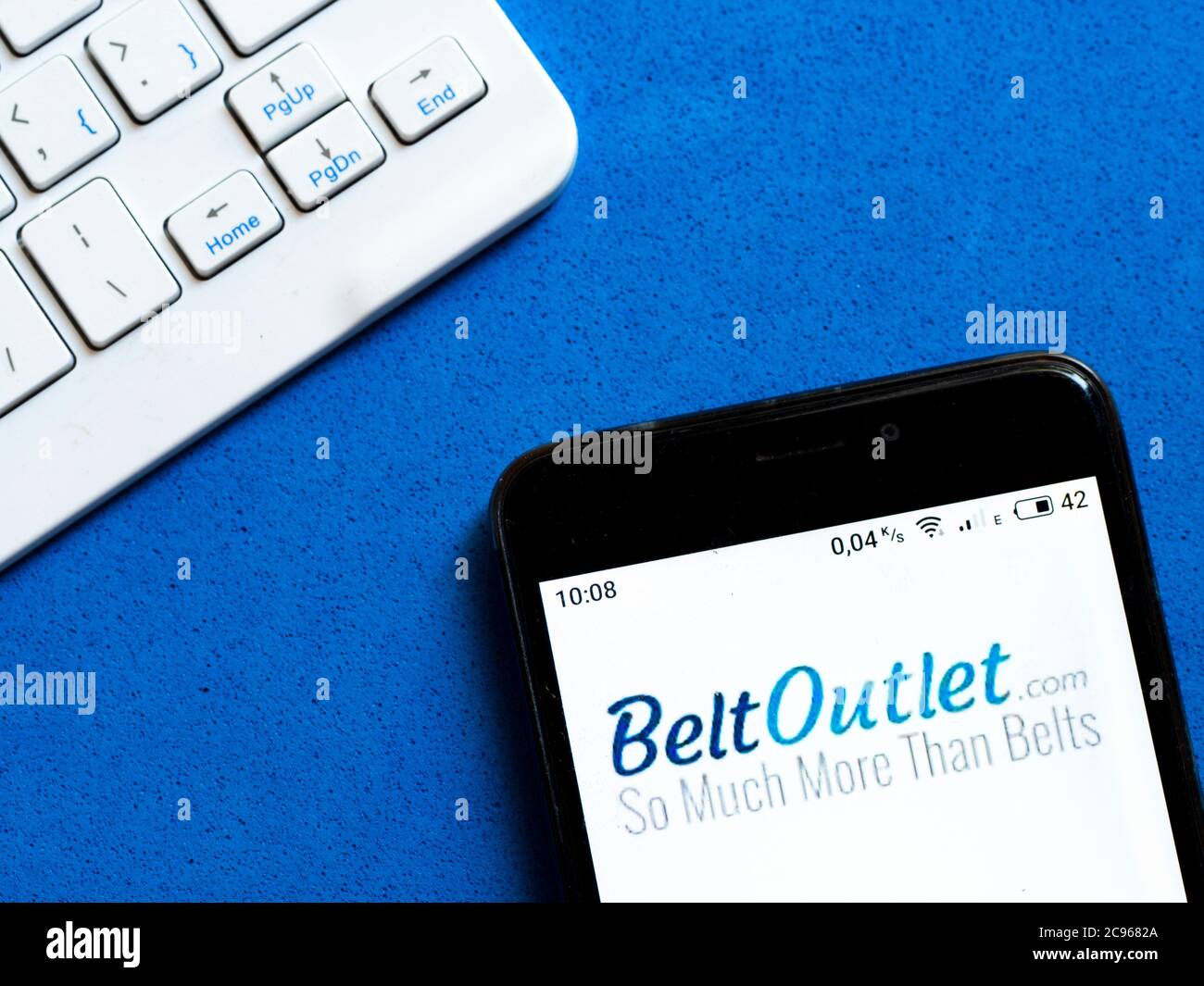 In this photo illustration a Belt Outlet logo is seen displayed on a ...