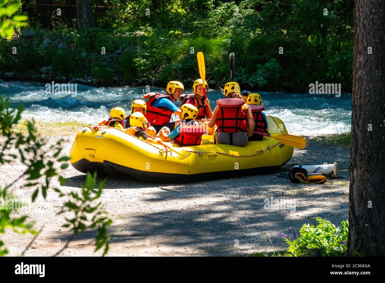 Children sitting in rubber raft before rafting on the small village of ...