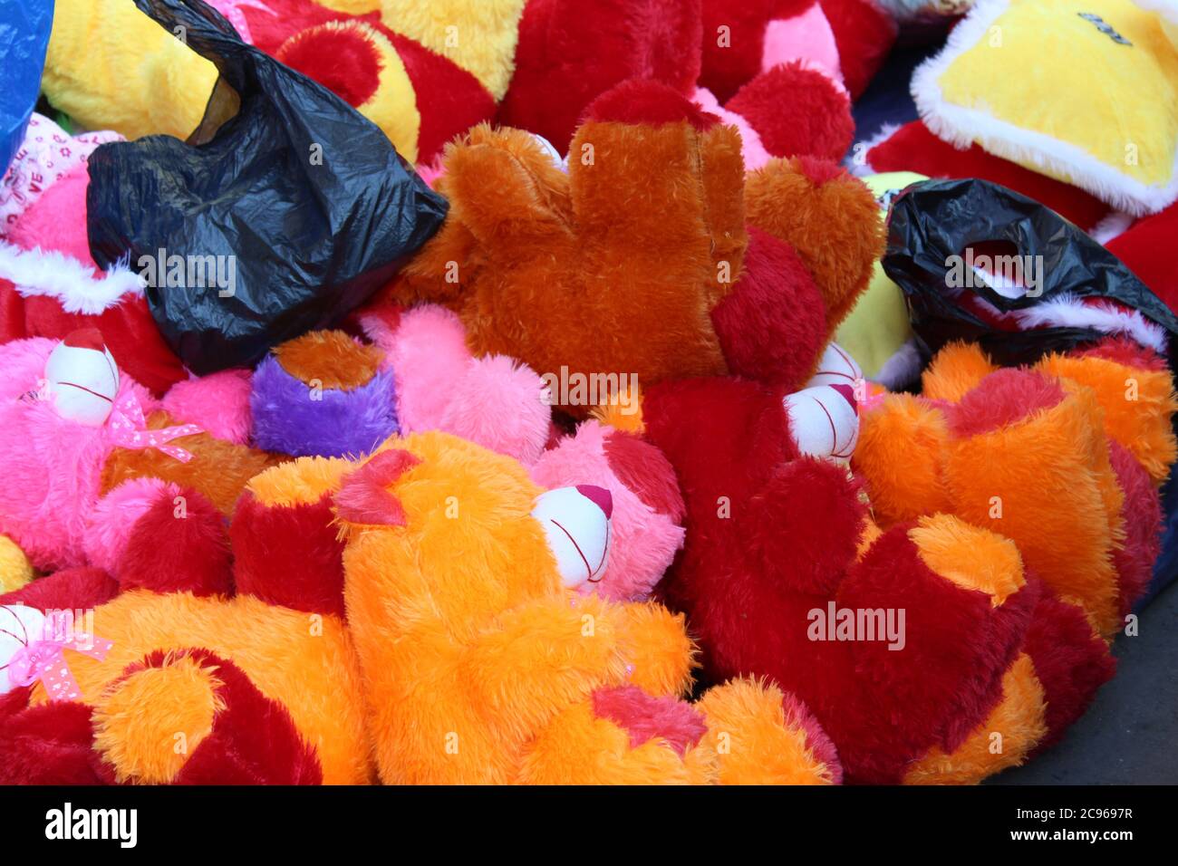 Colorful Teddy Bears selling on a open shop at a busy market, at ...