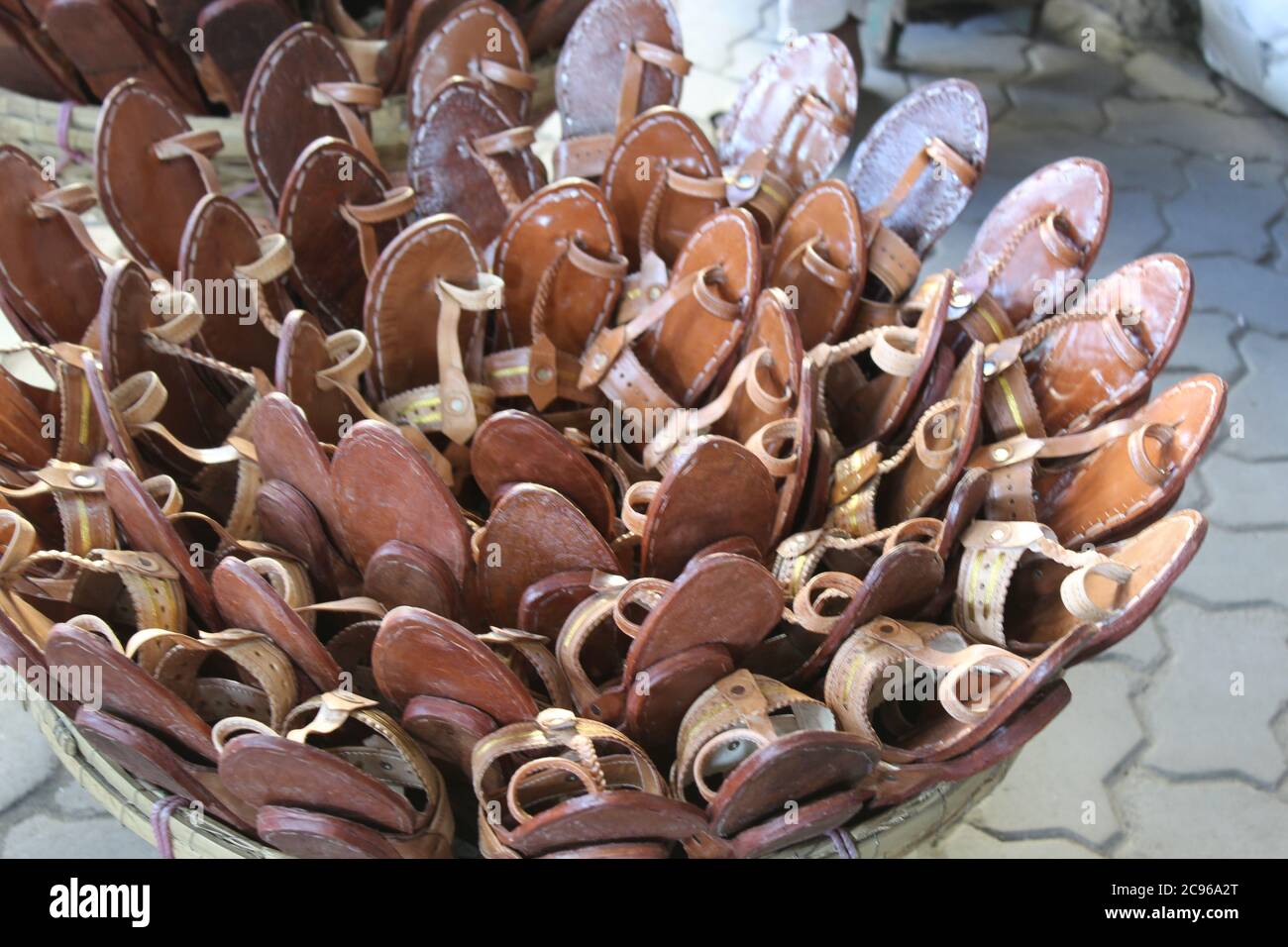 Indian Pure leather sandals selling on a open shop at Dharmatala ...