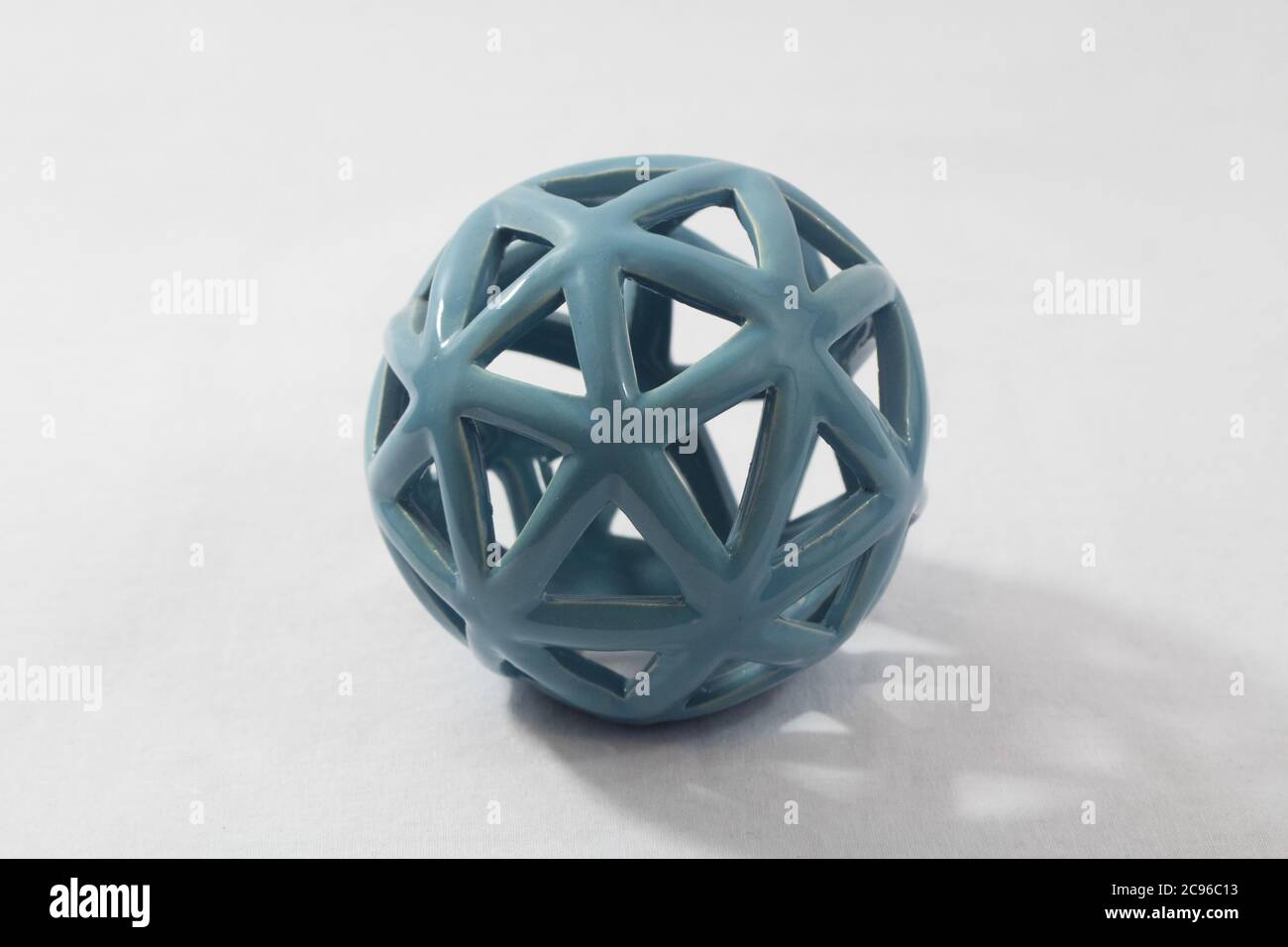 Closeup shot of a light blue sphere placed on a white background Stock ...
