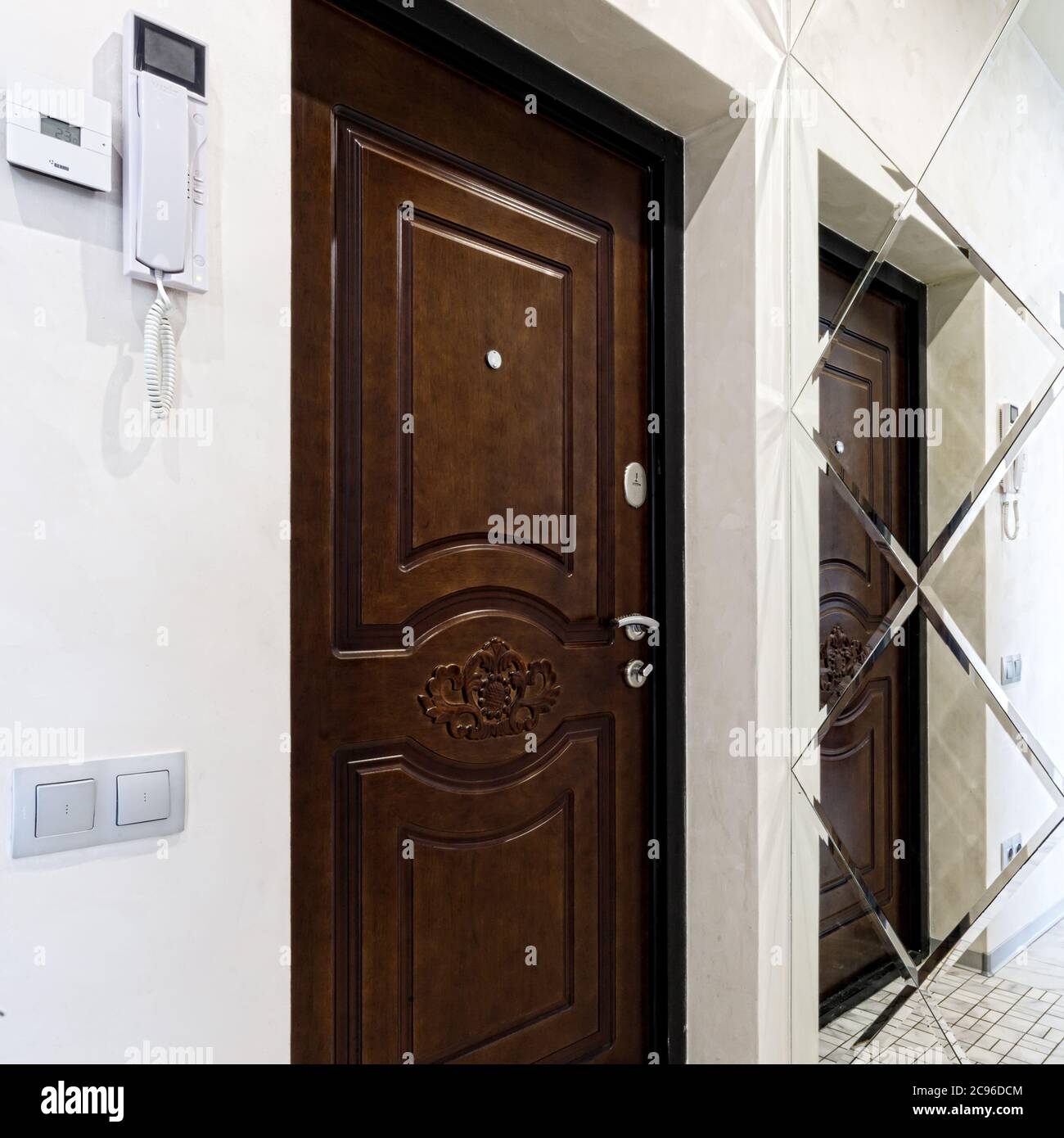 Modern wooden looking front door, very sturdy steel door Stock Photo ...