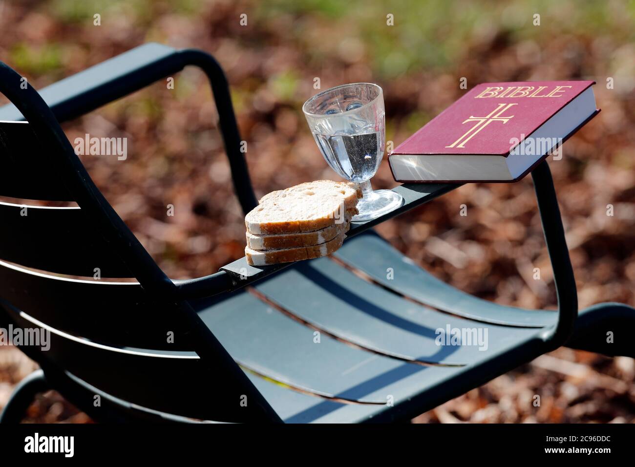 Bread, glass of water, and holy Bible during Lent. A solemn religious ...