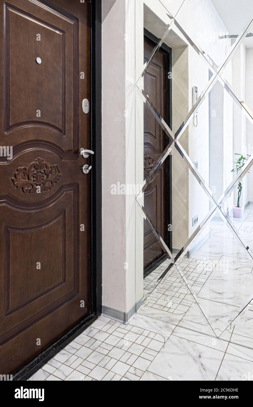 Modern wooden looking front door, very sturdy steel door Stock Photo ...