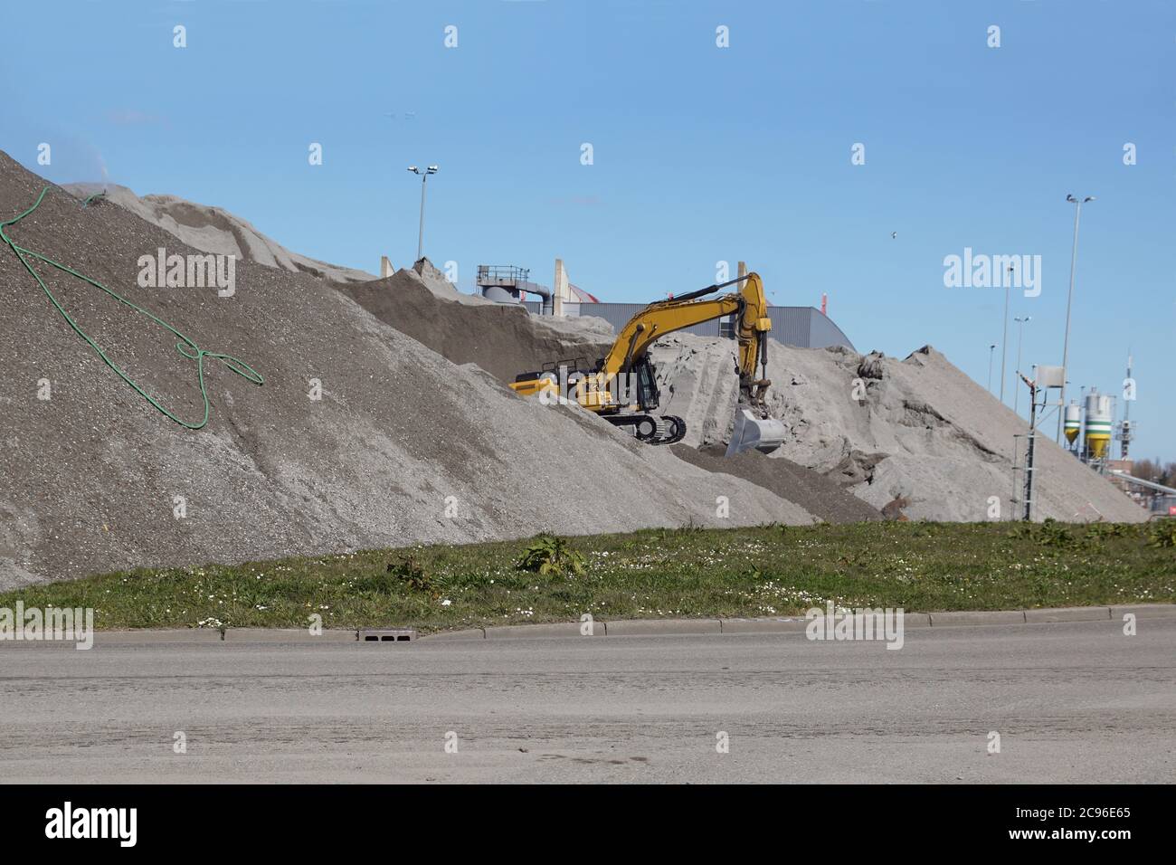 Piles of bottom ash from the waste recycling factory has been cleaned ...
