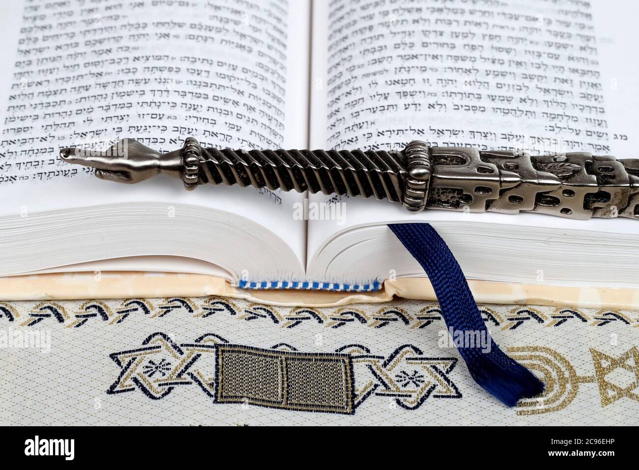 A silver Yad Jewish ritual pointer on a Torah. France Stock Photo - Alamy