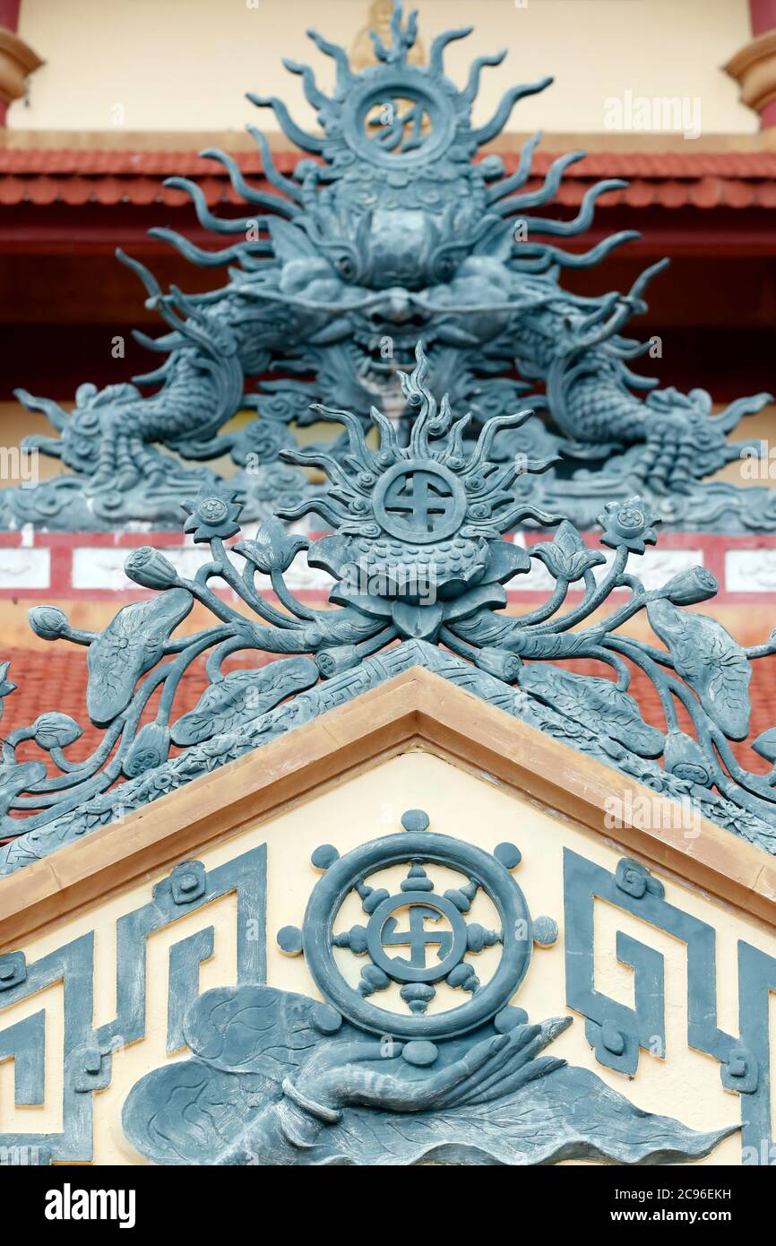 Long Khanh Buddhist Pagoda. Dragon, swastika and Dharma wheel. Buddhist ...