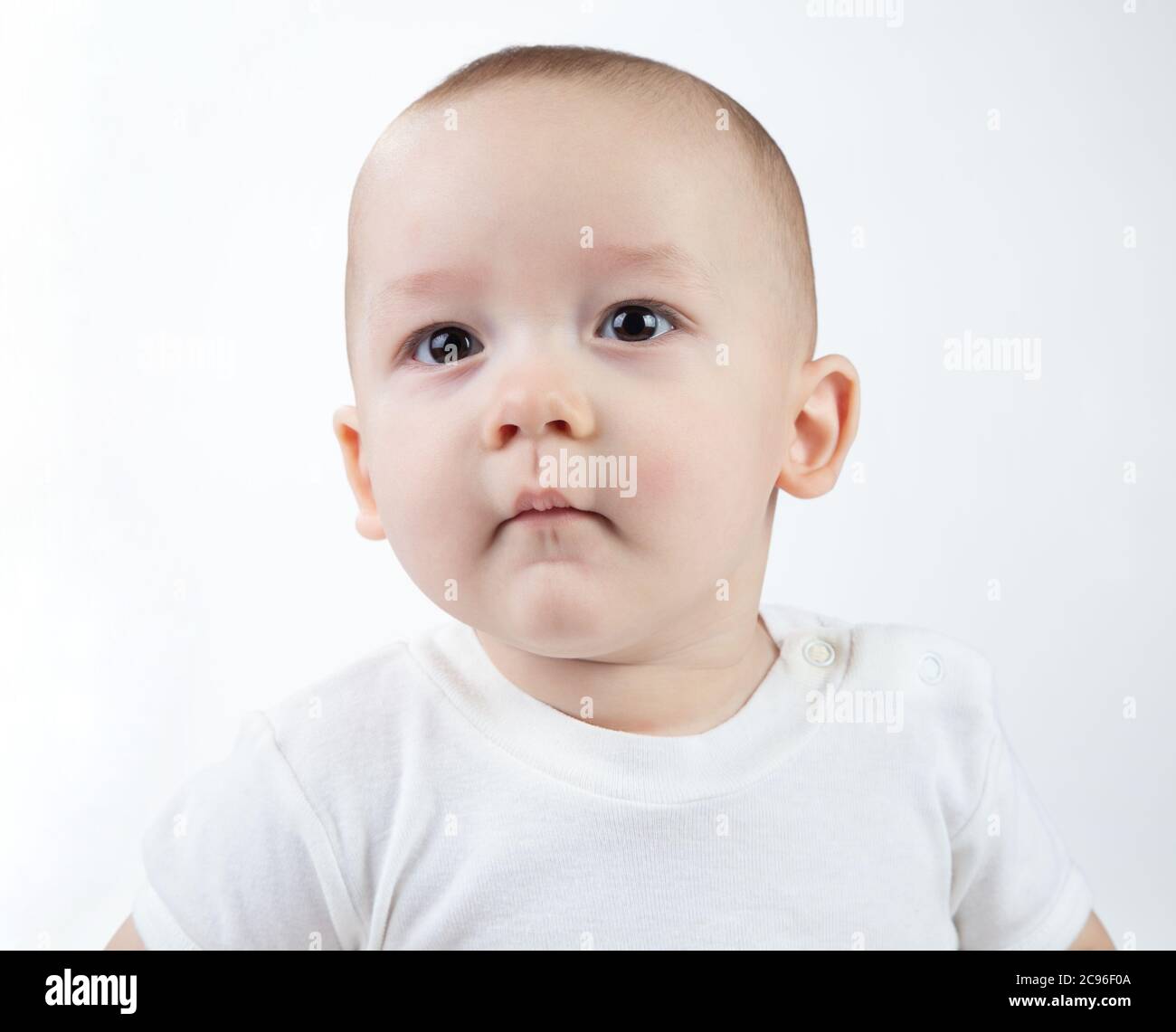 Portrait of a nine-month-old baby on a white background Stock Photo - Alamy