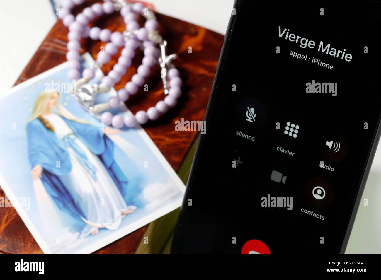 Image on a smartphone. Call to the Virgin Mary. France Stock Photo - Alamy