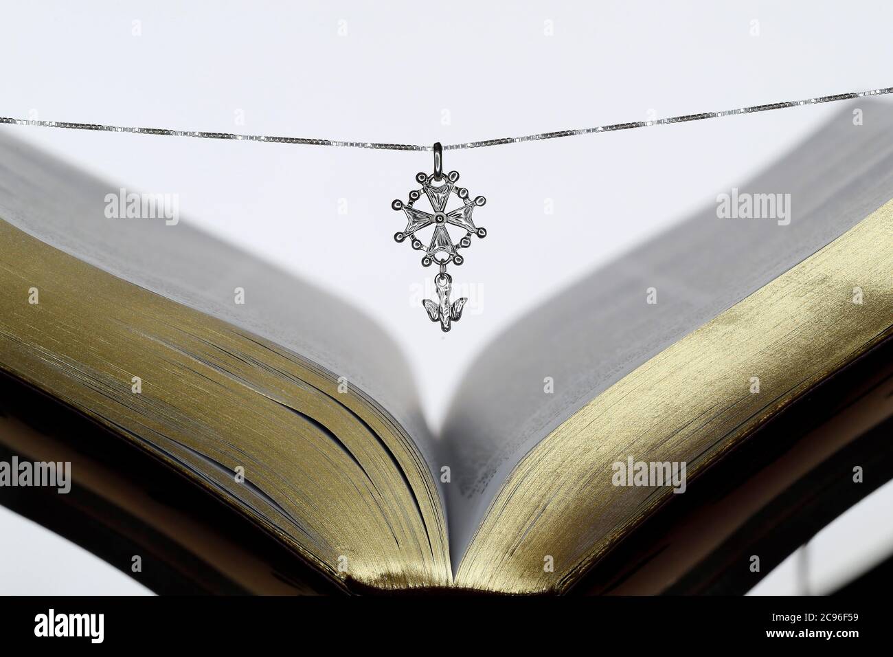 Open Bible and the Huguenot cross, a popular symbol of the evangelical ...