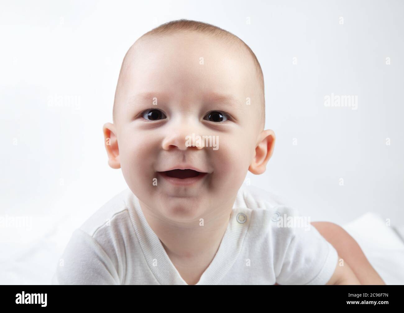 Portrait of a nine-month-old boy on a white background Stock Photo - Alamy