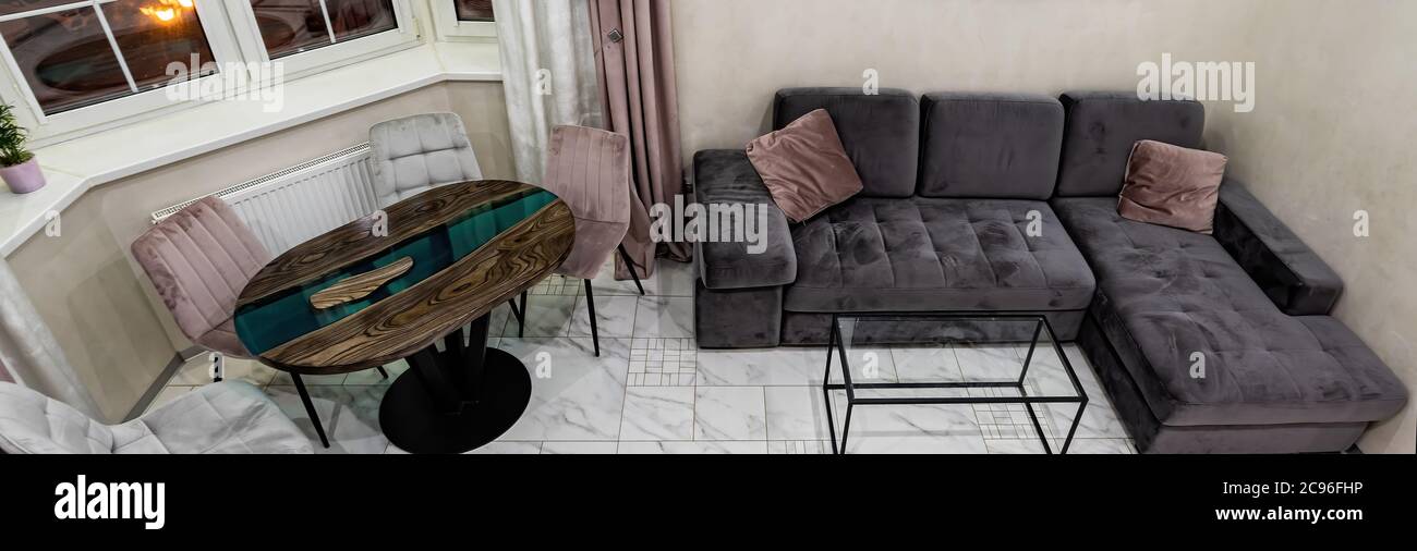 Modern interior of a large and cozy living room with a sofa and a table ...