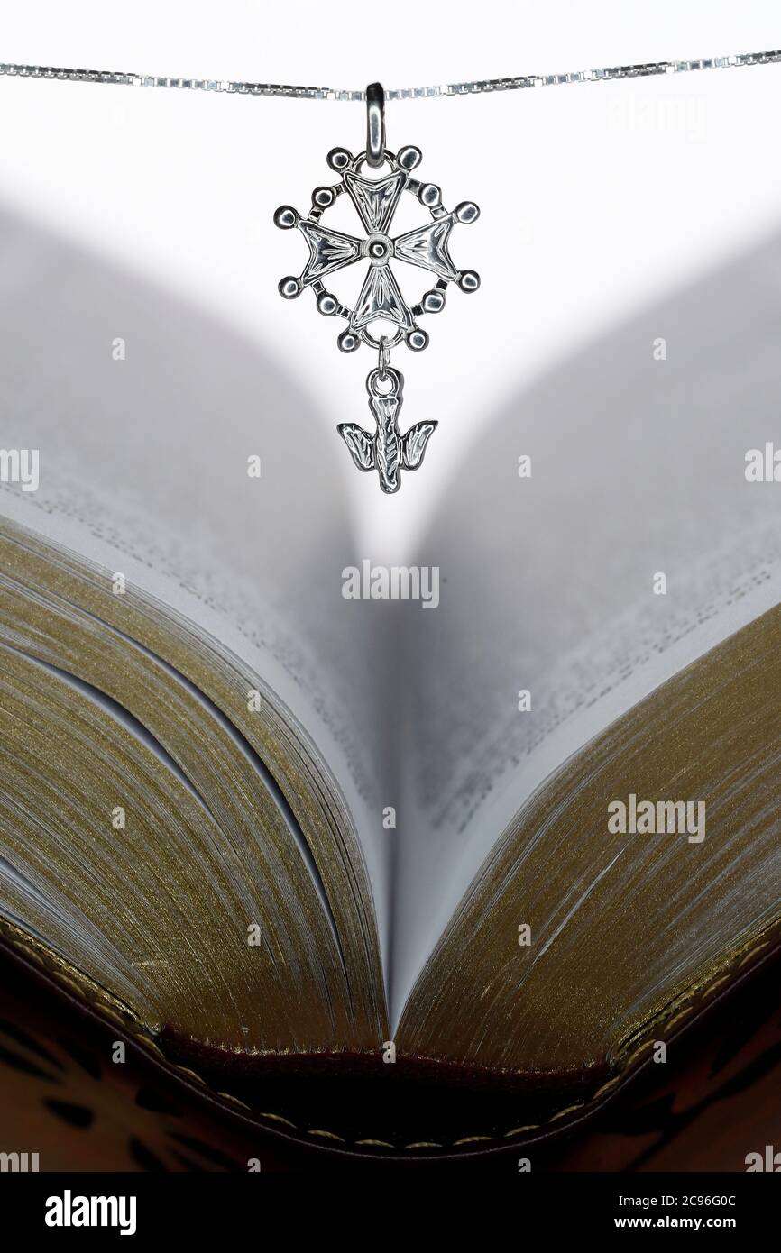 Open Bible and the Huguenot cross, a popular symbol of the evangelical ...