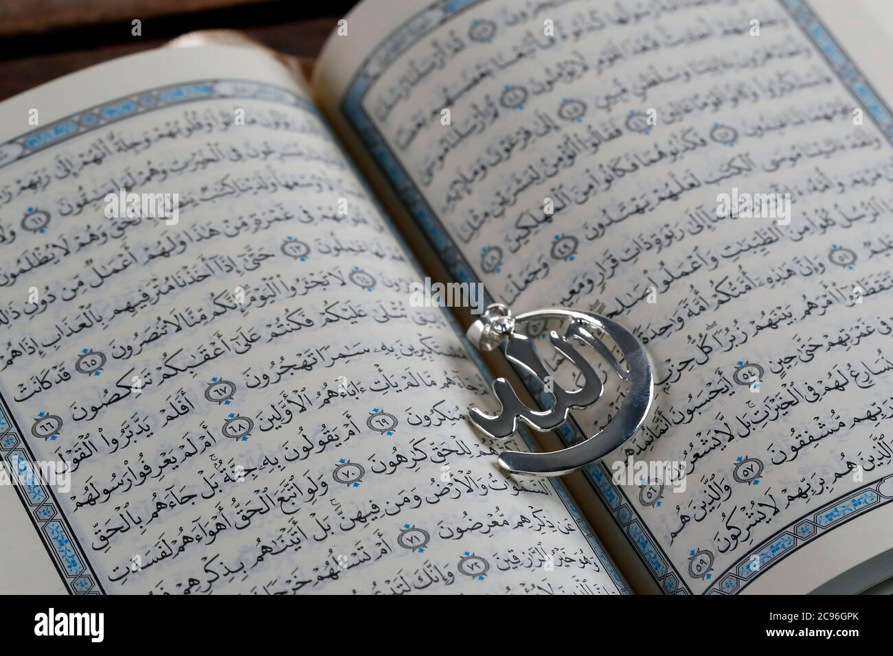 Open Quran. Allah monogram. France Stock Photo - Alamy