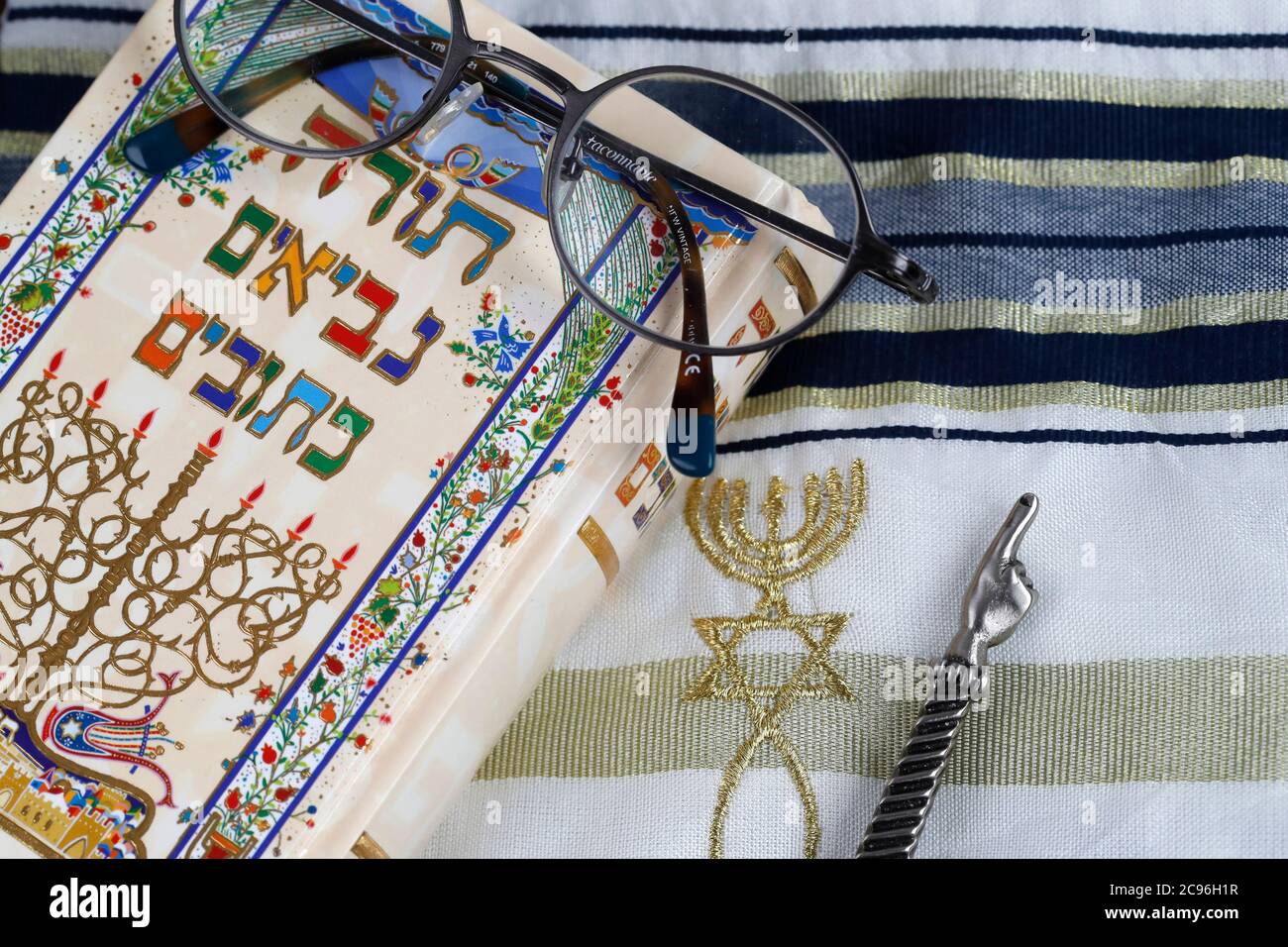 Sylver yad, tallit and Torah. Jewish symbols. France Stock Photo - Alamy
