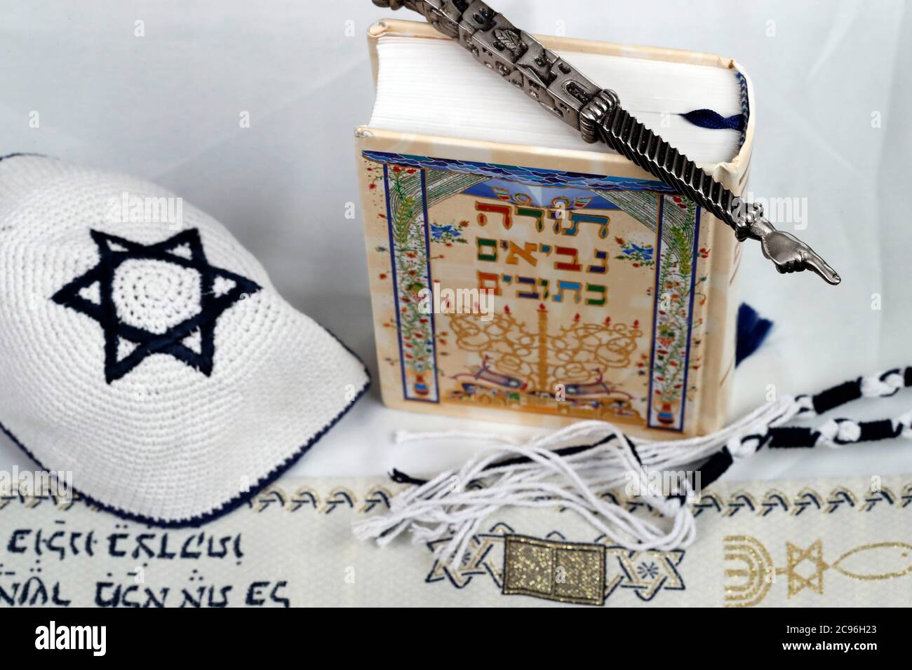Sylver yad, black and white tzitzit, tallit, kippah and Torah. Jewish ...