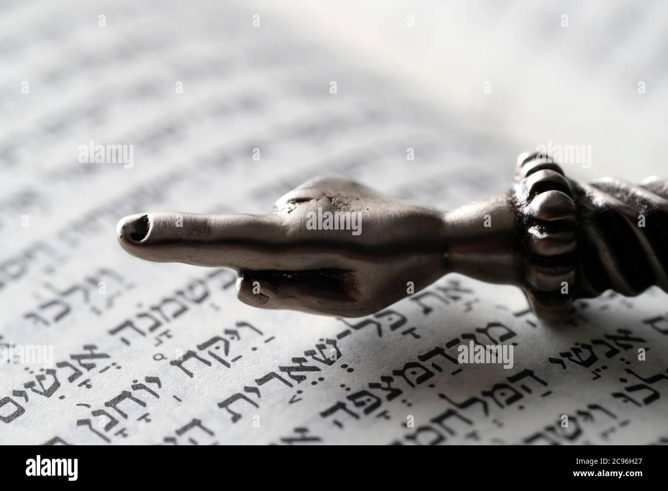 A silver Yad Jewish ritual pointer on a Torah. France Stock Photo - Alamy