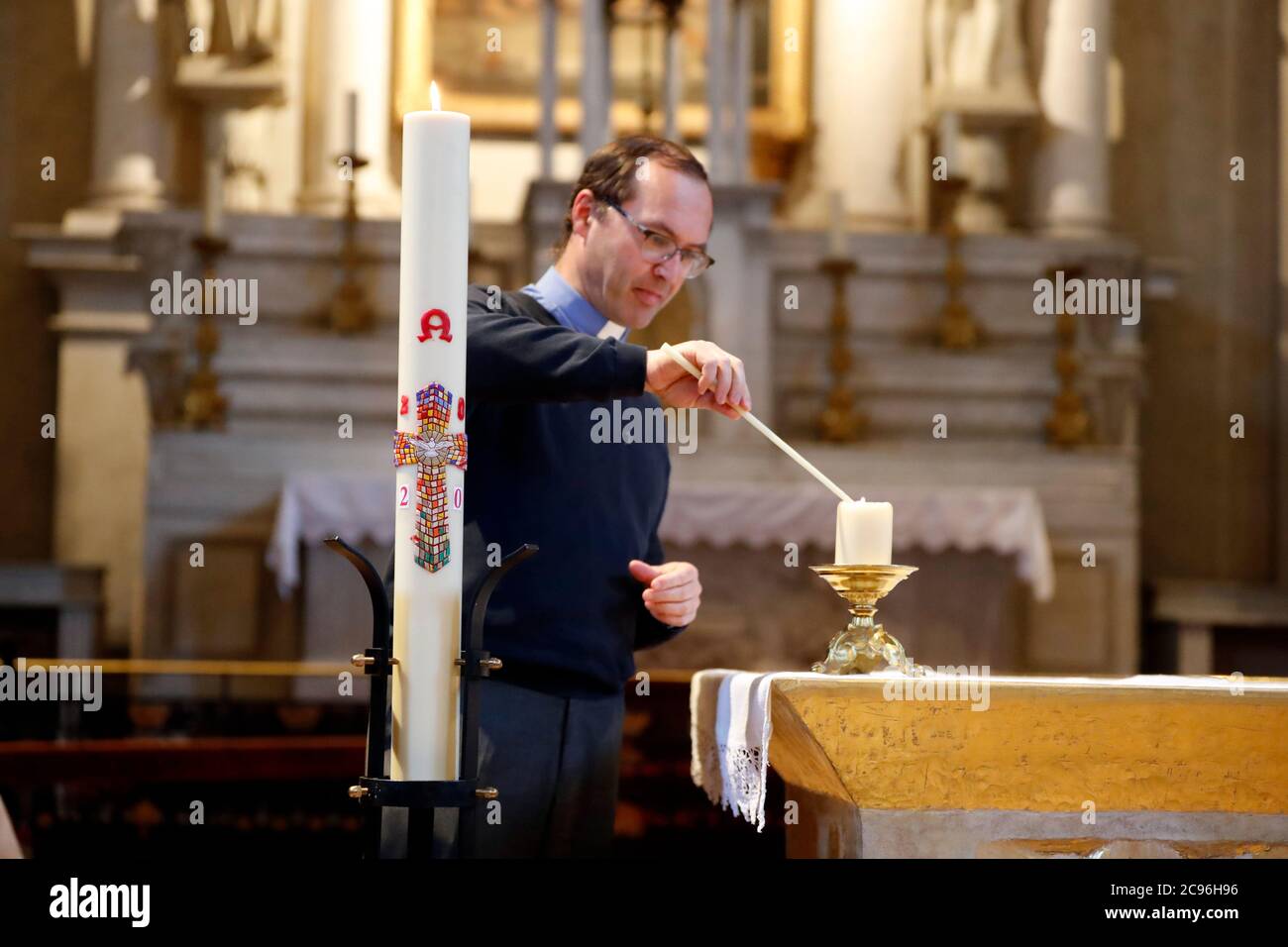 Paschal candle mass hi-res stock photography and images - Alamy