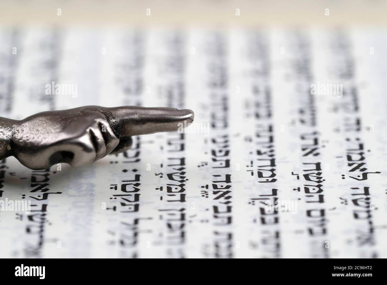 A silver Yad Jewish ritual pointer on a Torah. France Stock Photo - Alamy
