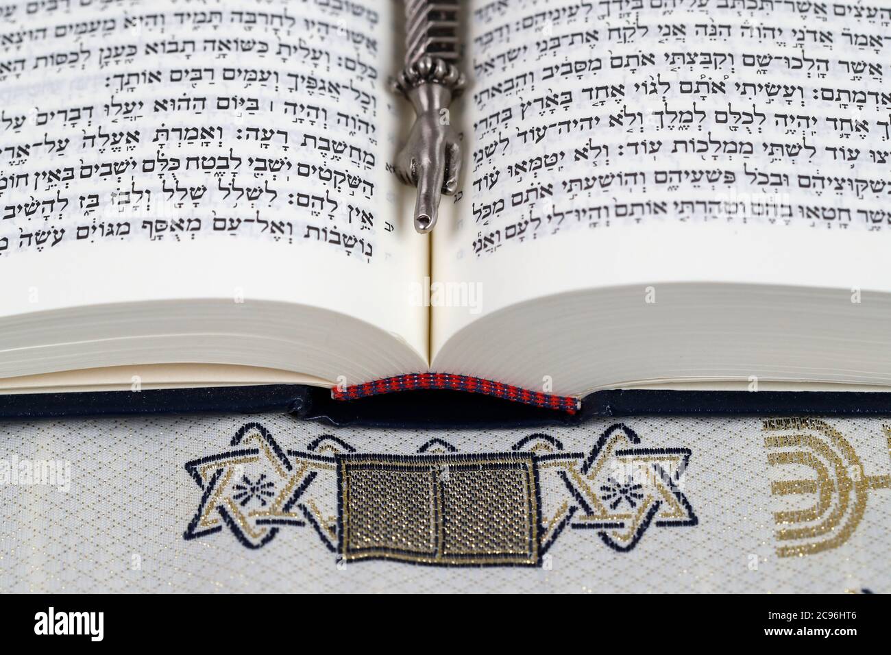 A silver Yad Jewish ritual pointer on a Torah. France Stock Photo - Alamy