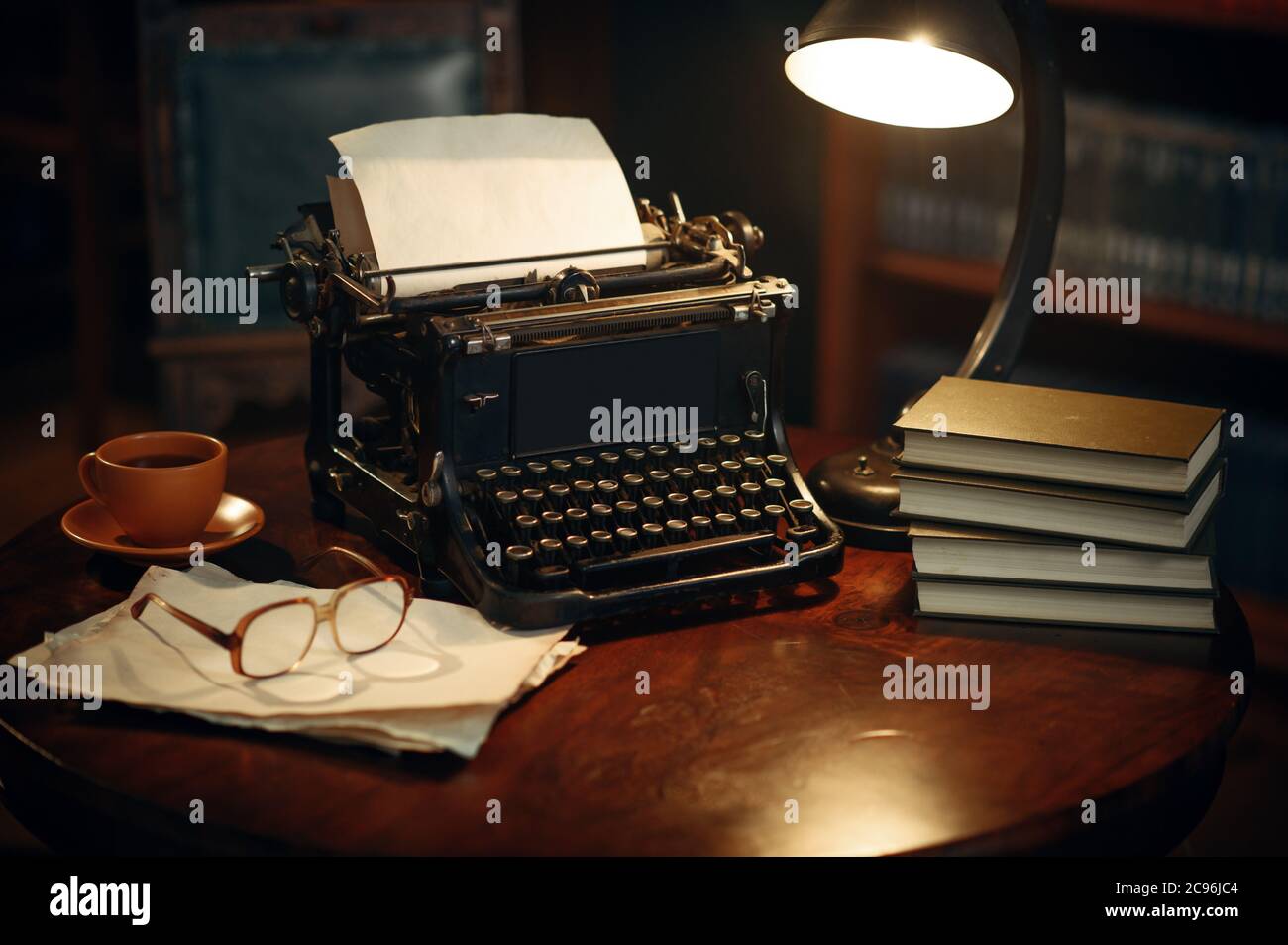 Vintage typewriter on wooden table in home office Stock Photo - Alamy