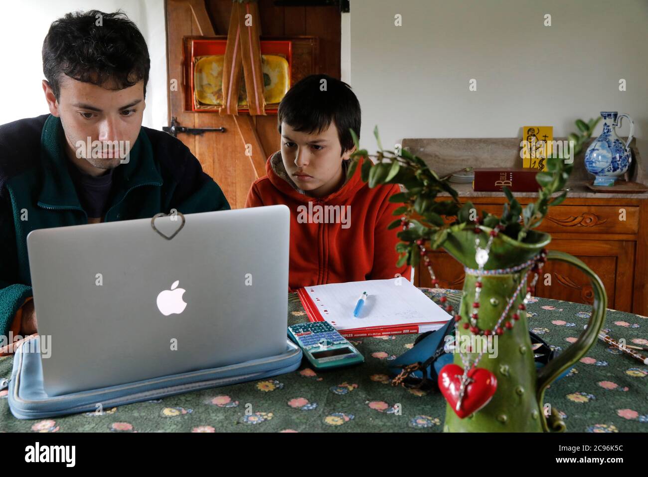 Christians brothers using a computer in Eure, France Stock Photo - Alamy
