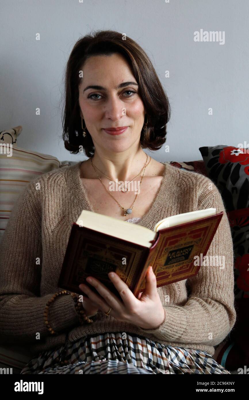 Kahina Bahloul, the first woman imam in France, holding a Kuran in ...