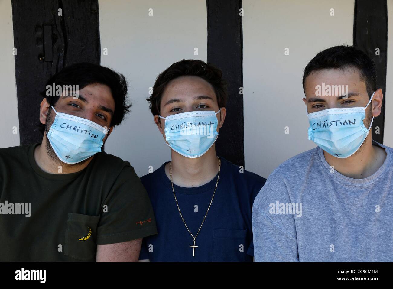 Young christians wearing protection masks in France Stock Photo - Alamy