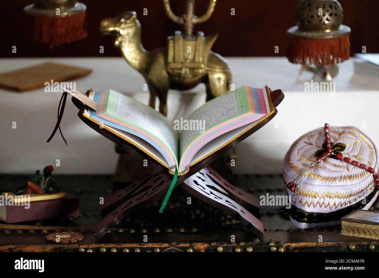 An open Holy Quran on wood stand at home. France Stock Photo - Alamy