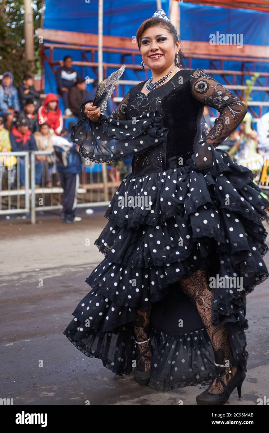 Members of a Waca Waca dance group in ornate costume parade through the ...