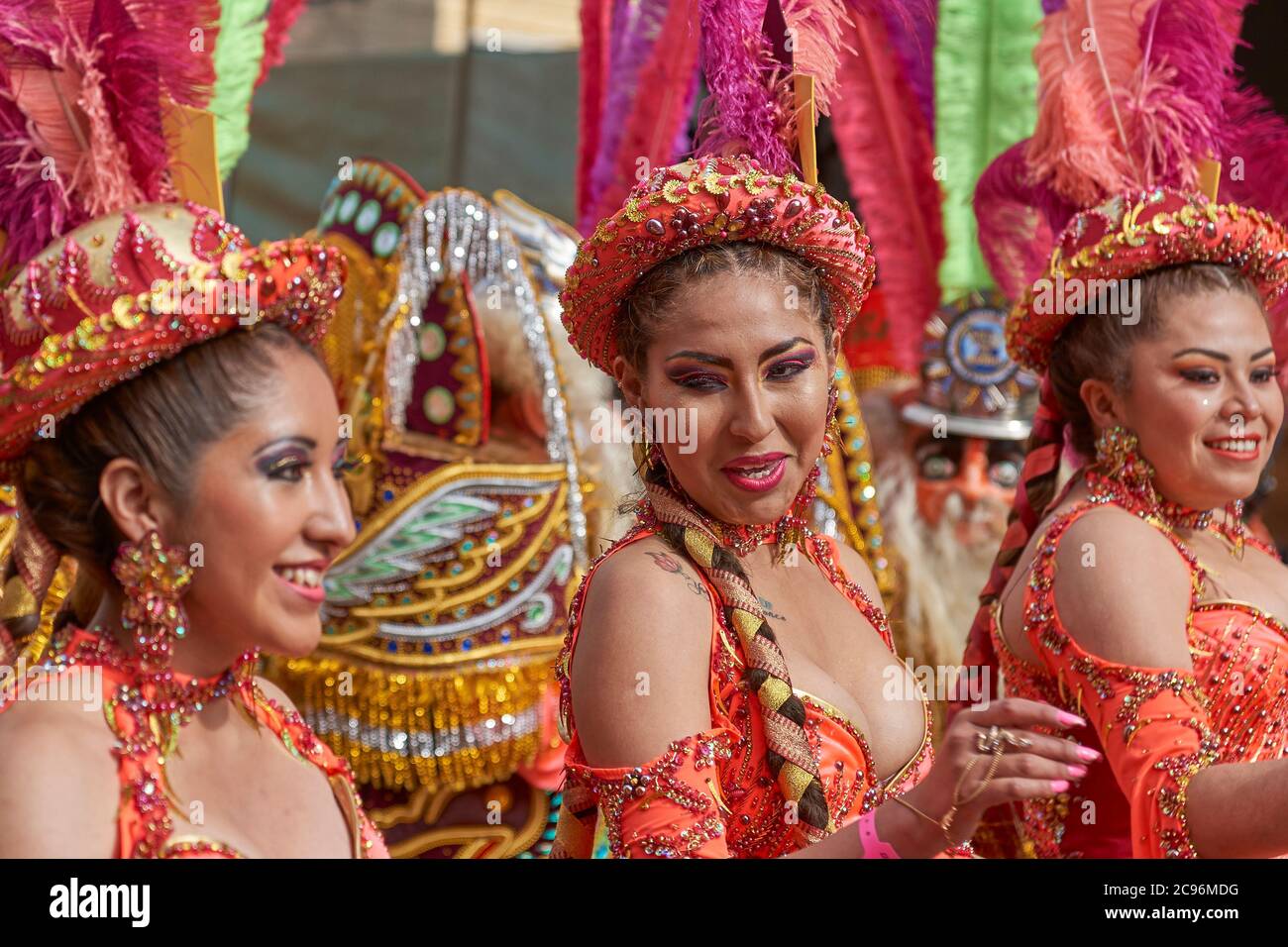 Morenada dancers in ornate costumes parade through the mining city of ...