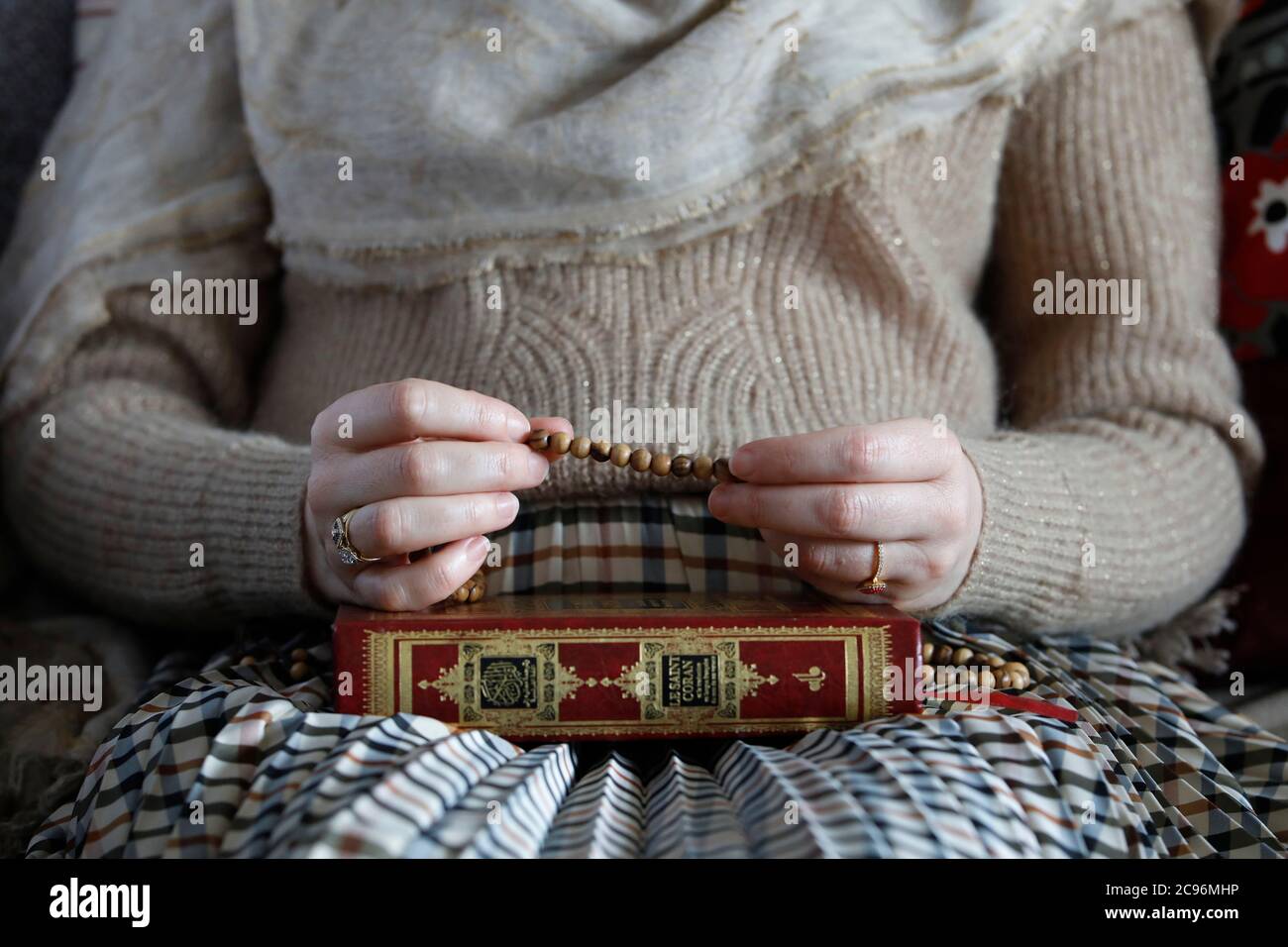 Kahina Bahloul, the first woman imam in France, with prayer beads and a ...