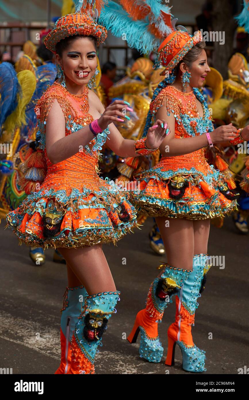 Morenada dancers in ornate costumes parade through the mining city of ...
