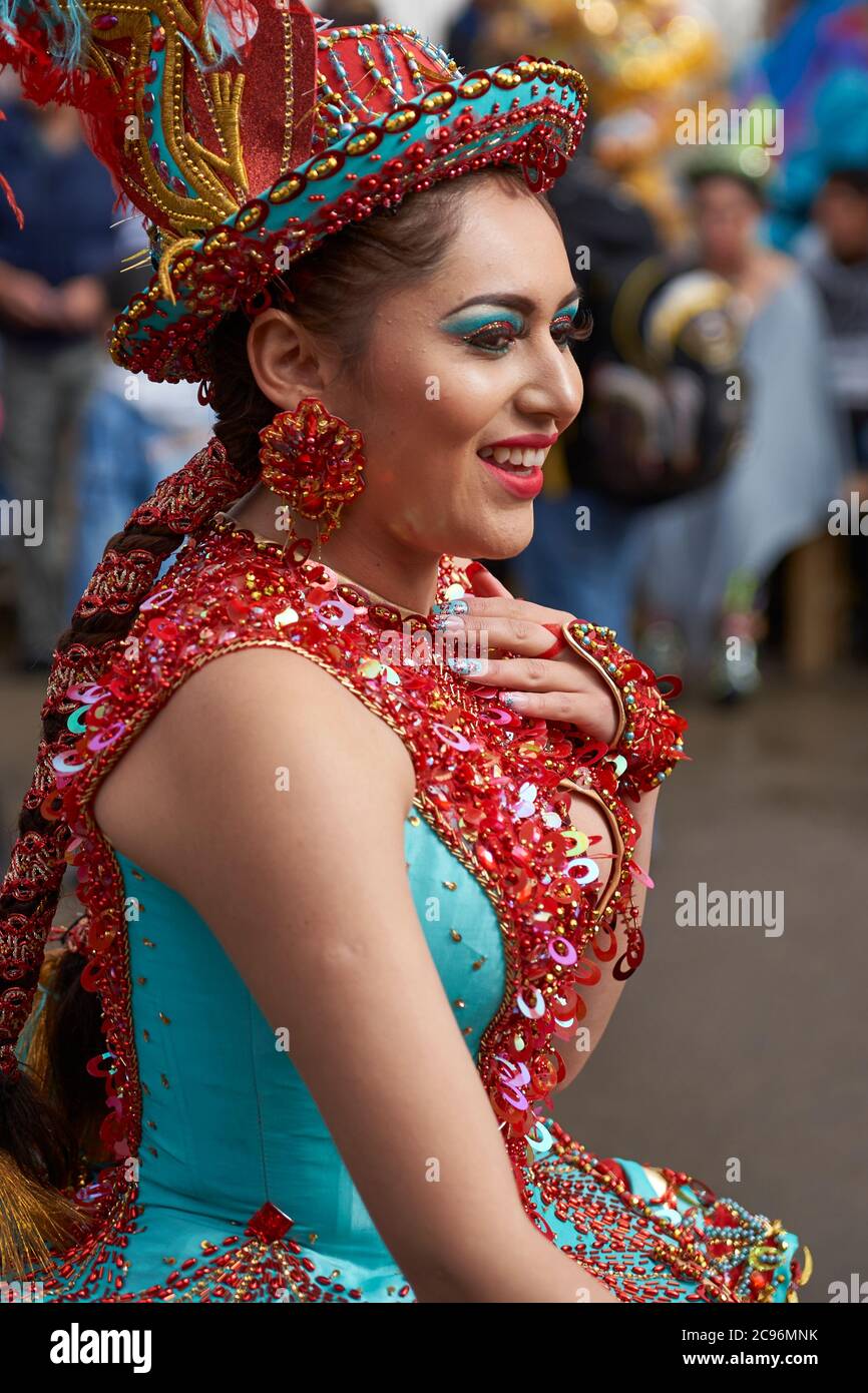 Morenada dancers in ornate costumes parade through the mining city of ...