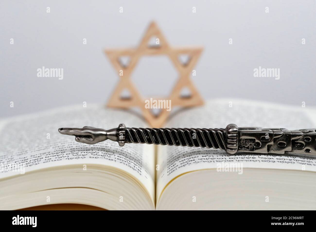 A silver Yad Jewish ritual pointer, a Jewish star or star of David and ...