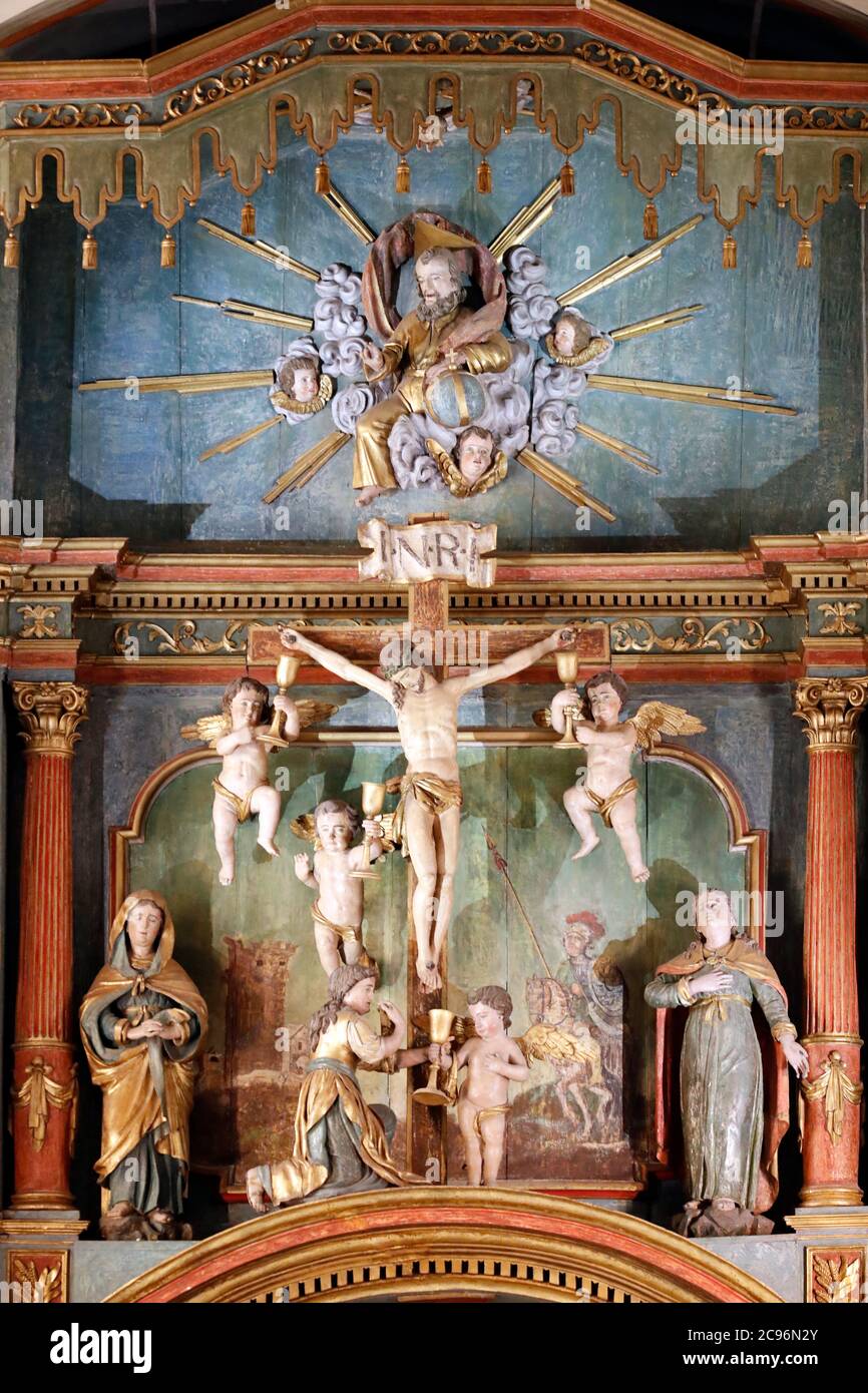Saint Maurice church. Baroque retable. Jesus on the cross. Thones ...
