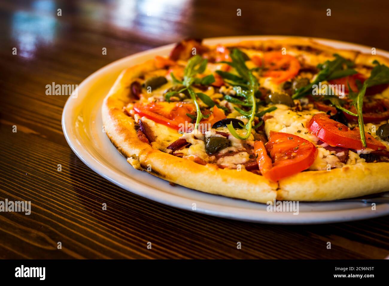 Hot pizza in the delivery plate, fast delivery times, the concept of ...