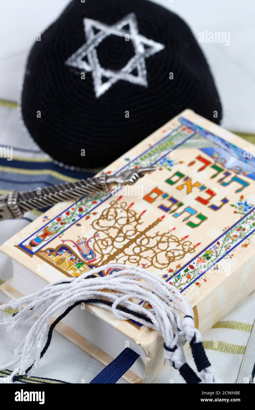 Sylver yad, black and white tzitzit, tallit, kippah and Torah. Jewish ...
