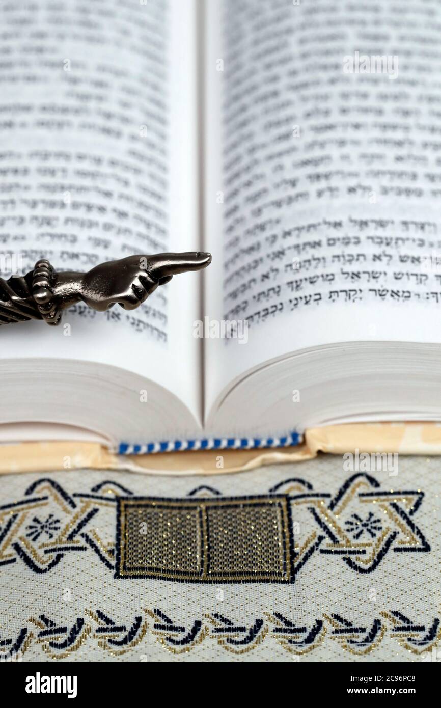 A silver Yad Jewish ritual pointer on a Torah. France Stock Photo - Alamy