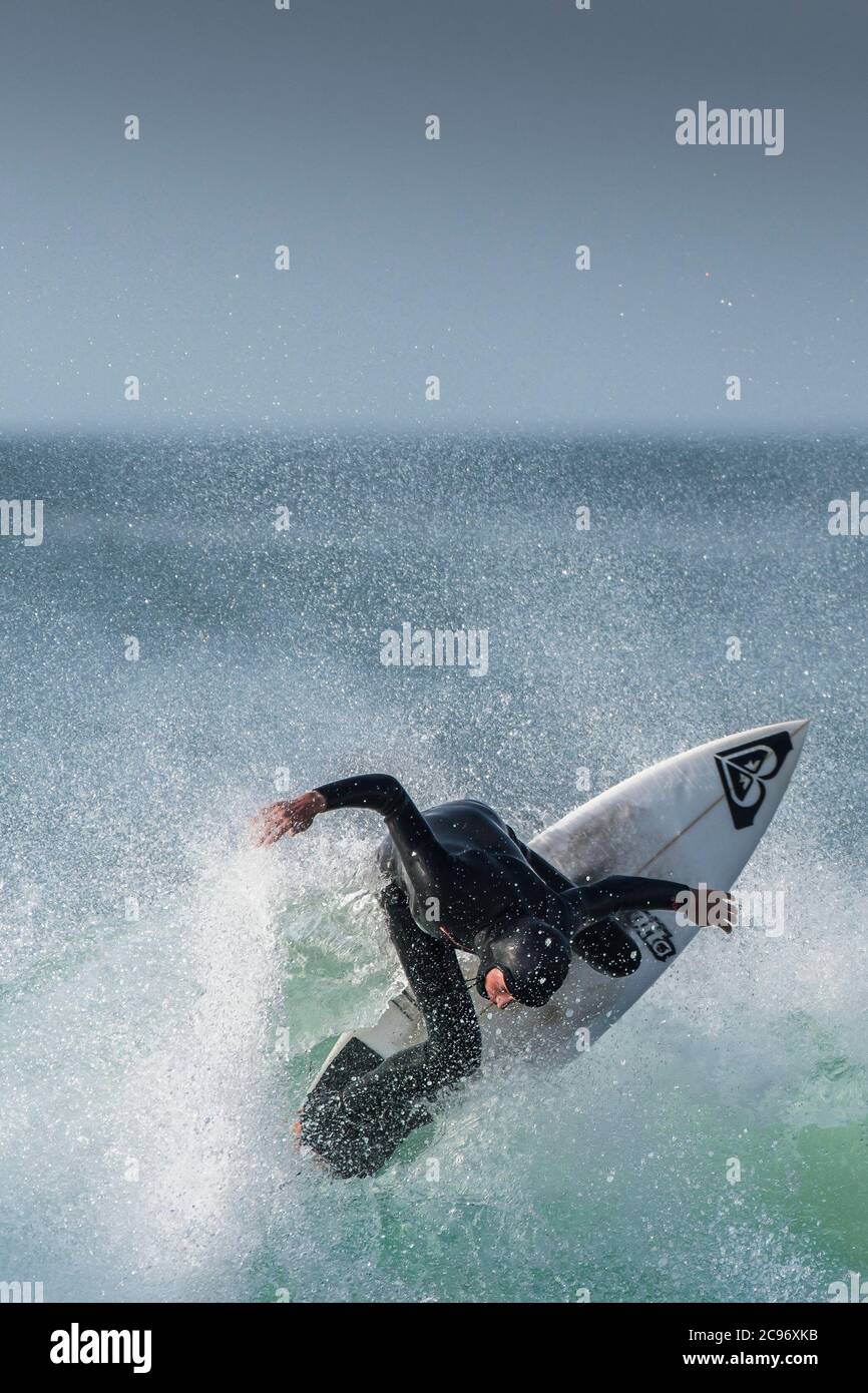 Spectacular surfing action as a surfer rides a wave at Fistral in ...