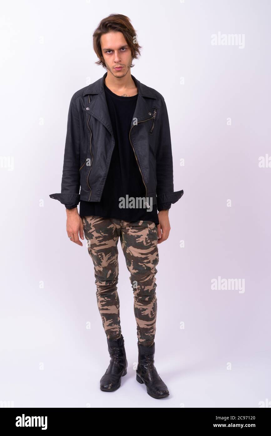 Young handsome rebellious man against white background Stock Photo - Alamy