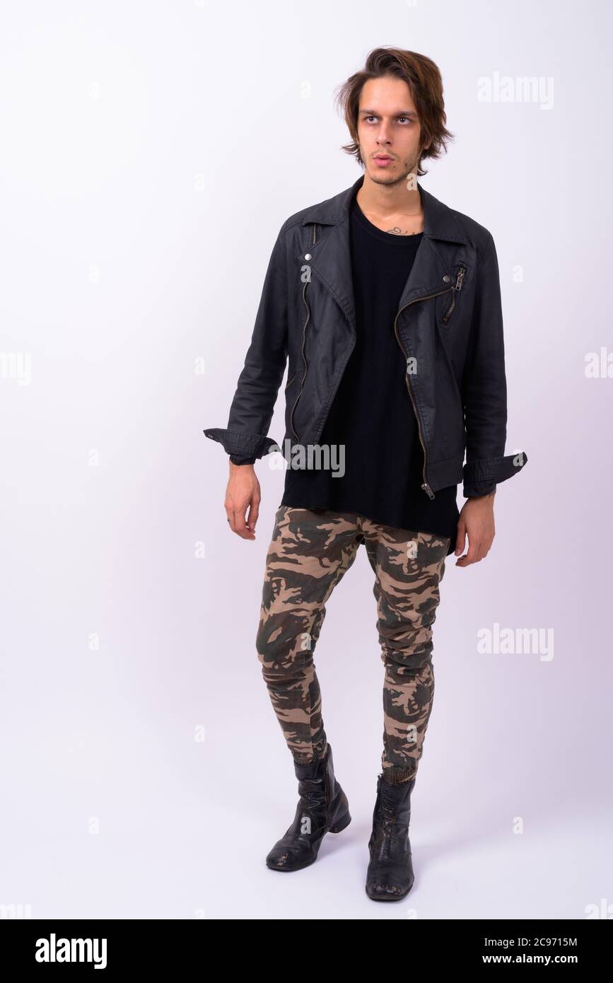 Young handsome rebellious man against white background Stock Photo - Alamy