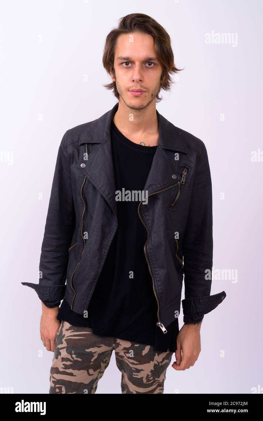 Young handsome rebellious man against white background Stock Photo - Alamy