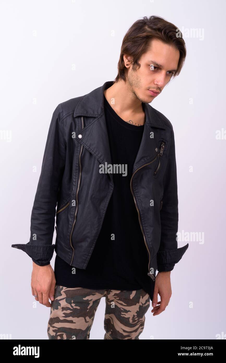 Young handsome rebellious man against white background Stock Photo - Alamy